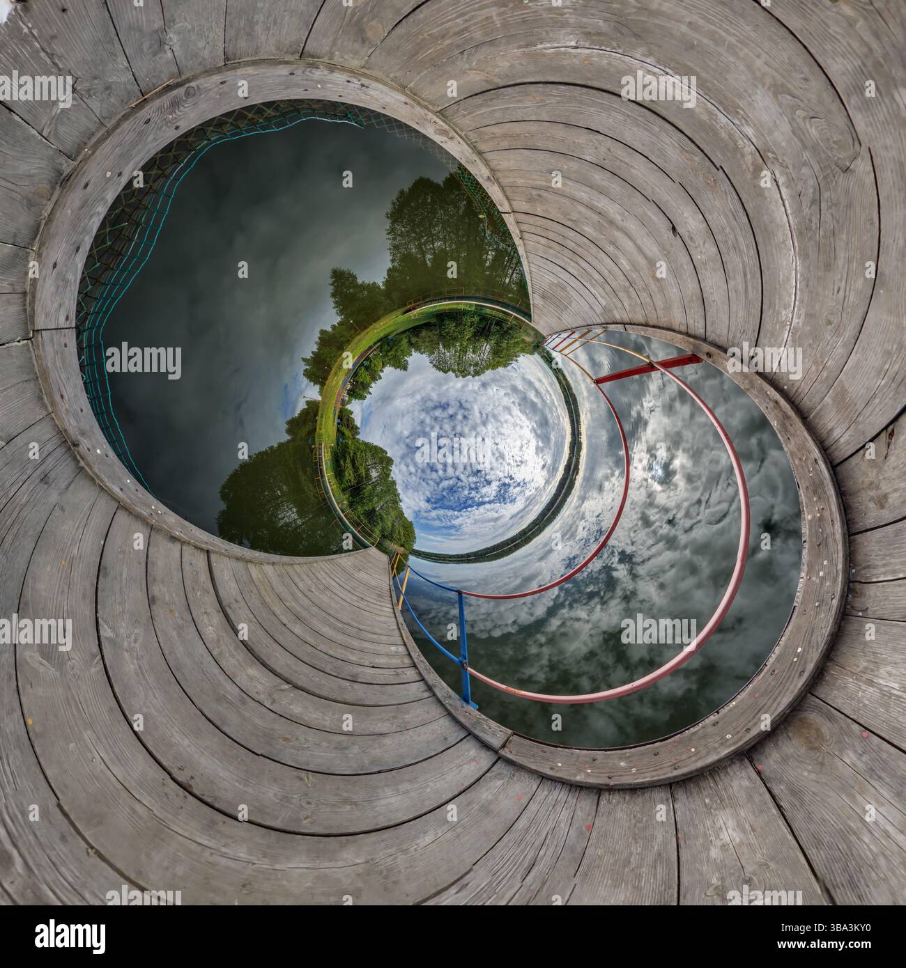 blue hole sphere or globe little planet inside grass or sand or dry ...