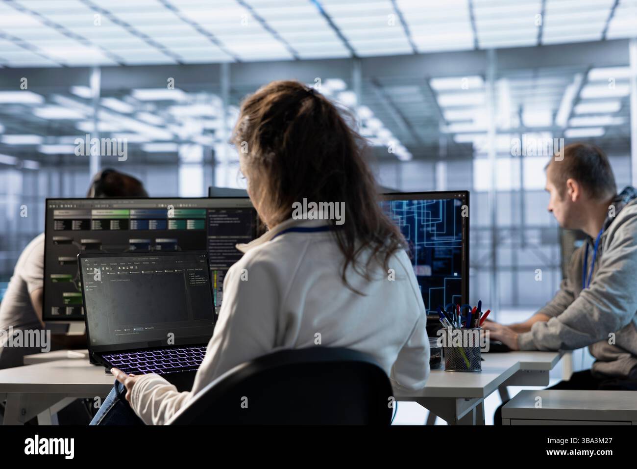 IT staff member programming in AI server farm housing advanced ...