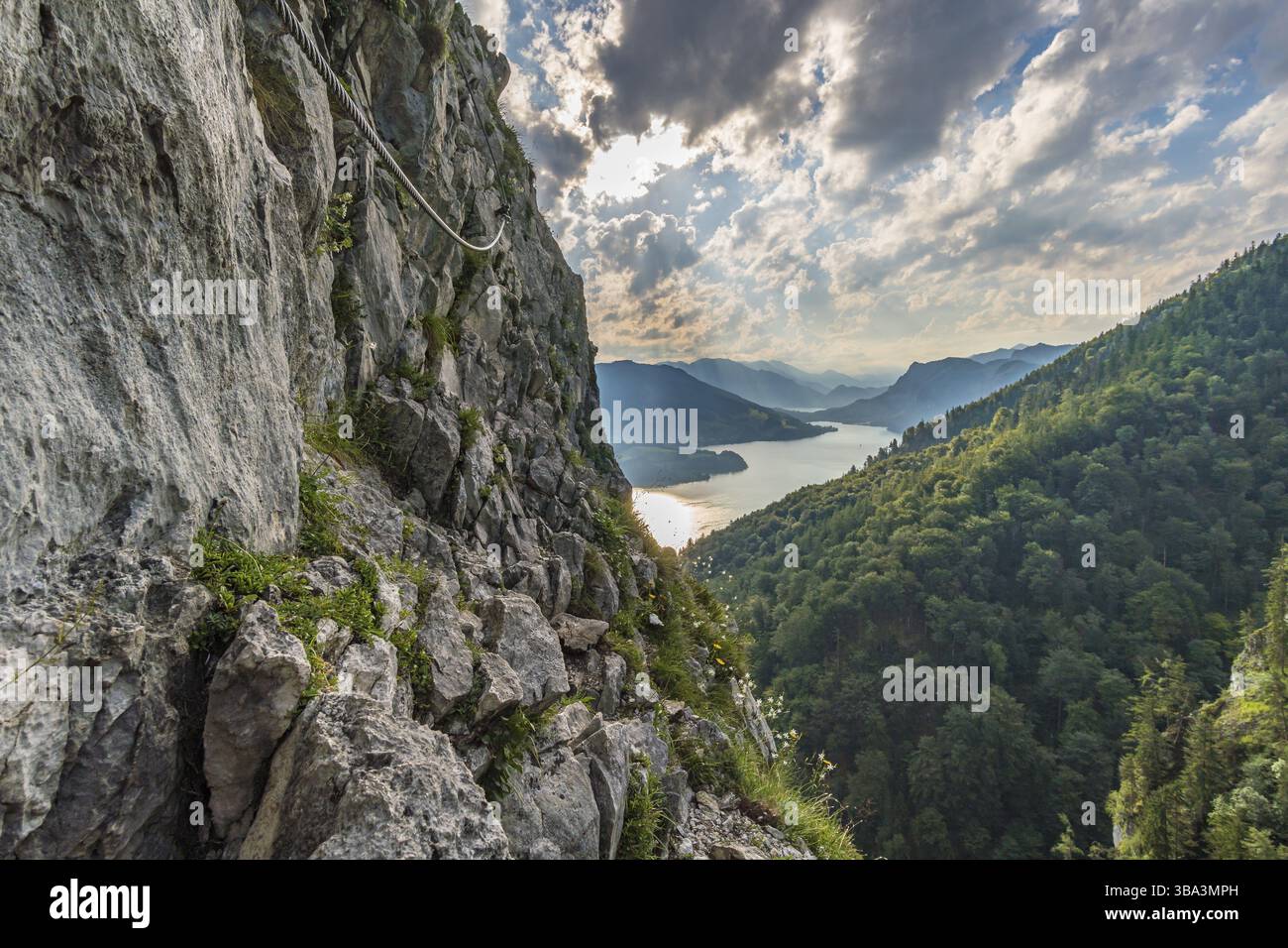 Climbing on the Drachenwand via ferrata at the beautiful Mondsee Stock ...