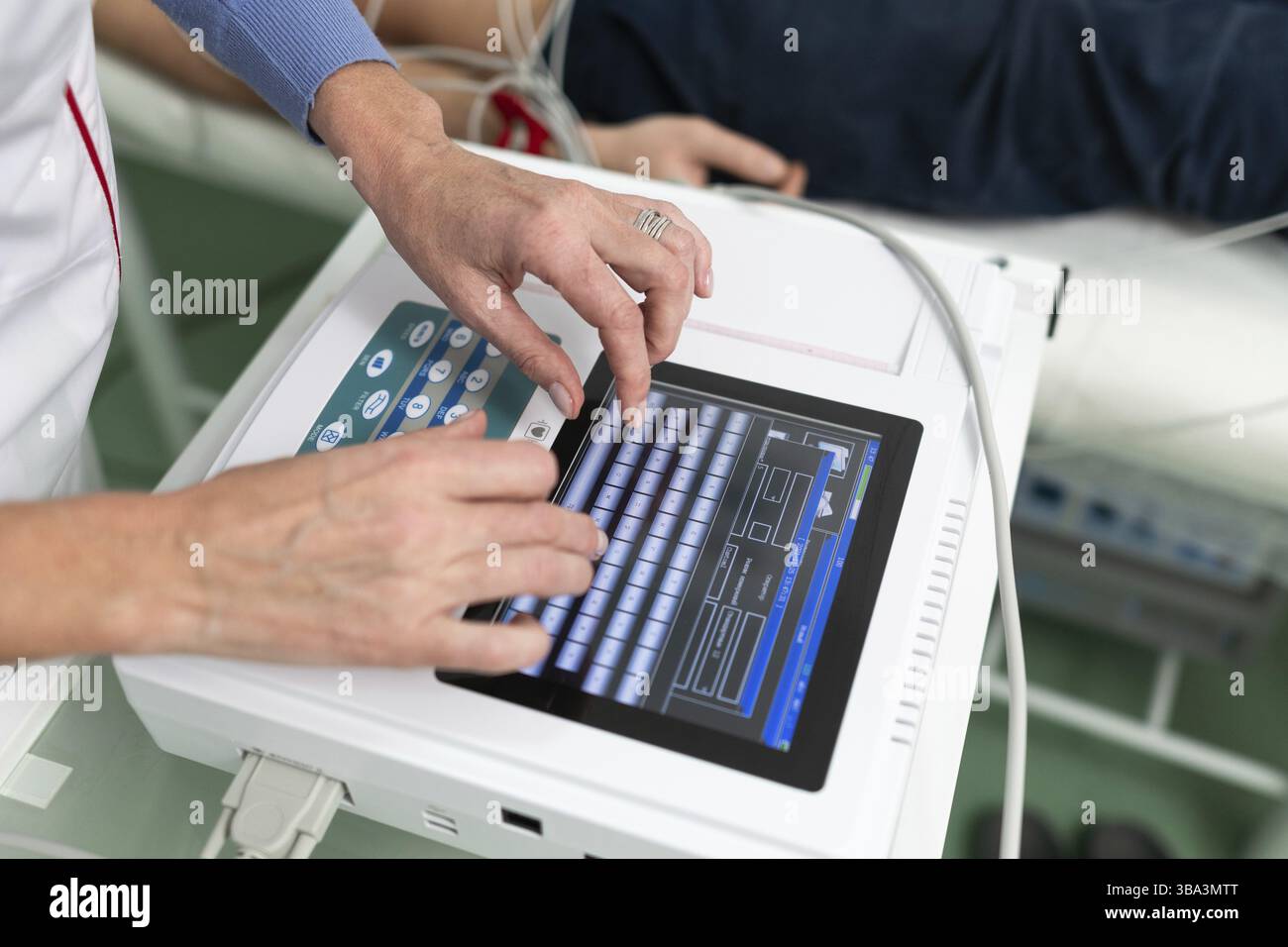 Medical equipment for electrocardiogram. Doctors doing ECG test on male ...