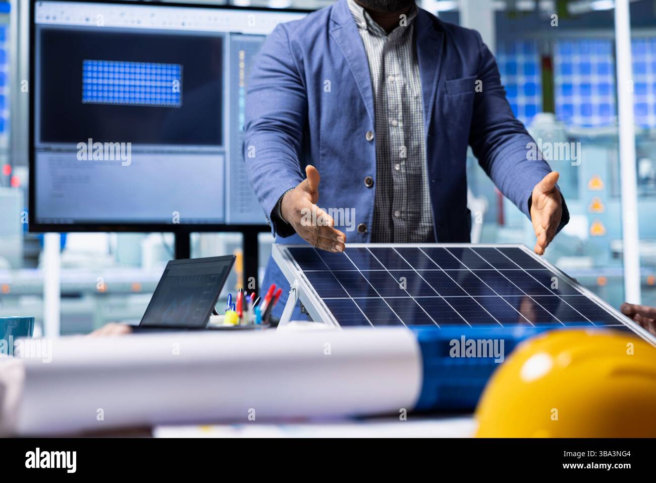 Photovoltaics factory team evaluating solar cells designs to improve ...