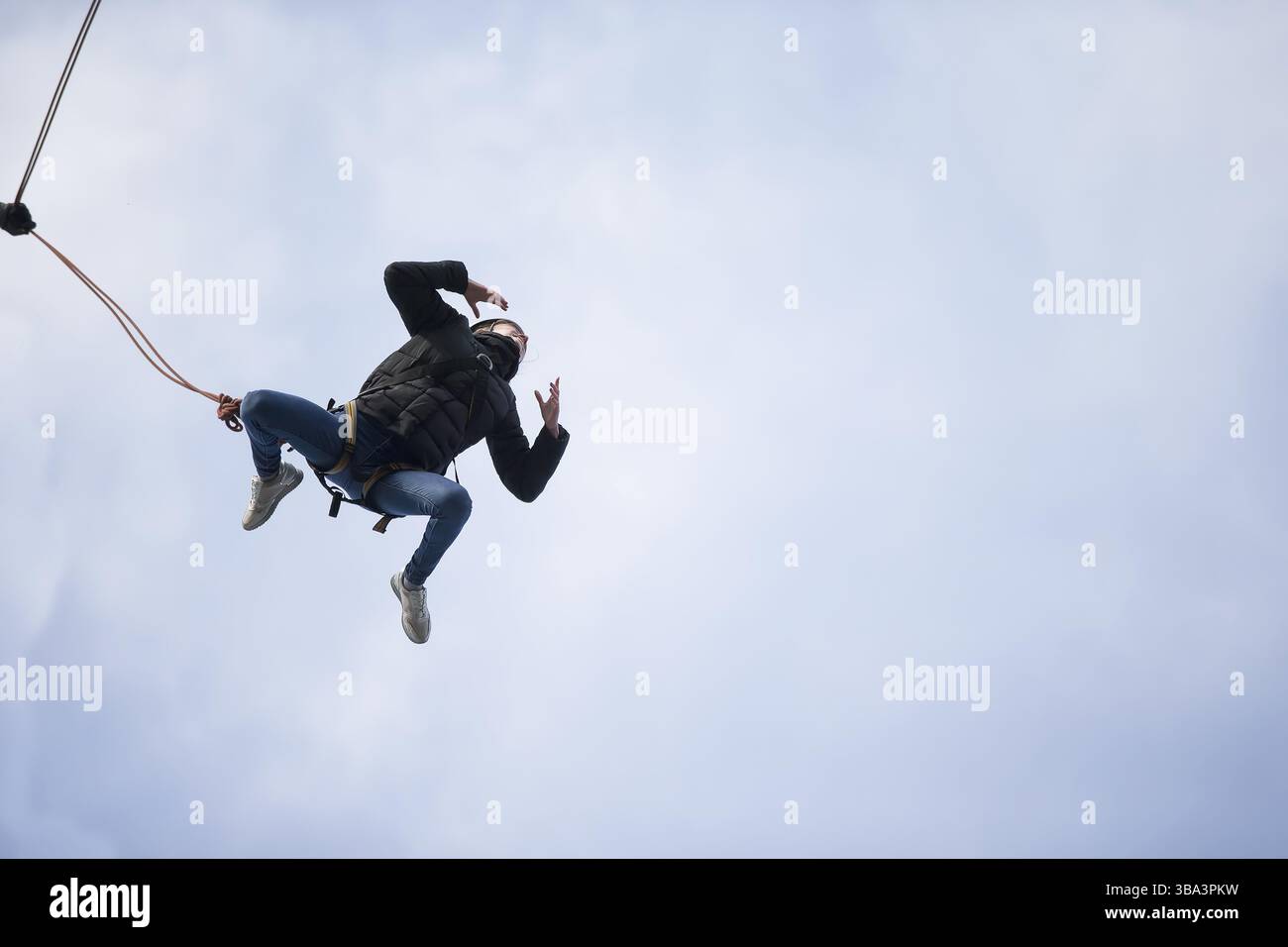 Belarus, Gomel, March 08, 2019. Jumping from the bridge to the rope ...