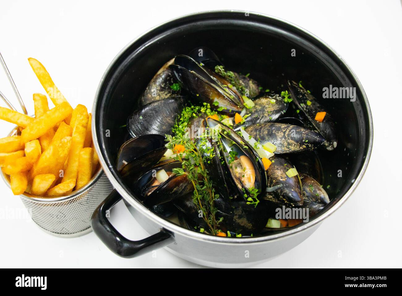 steamed dutch mussels in cream sauce pot with white background Stock ...