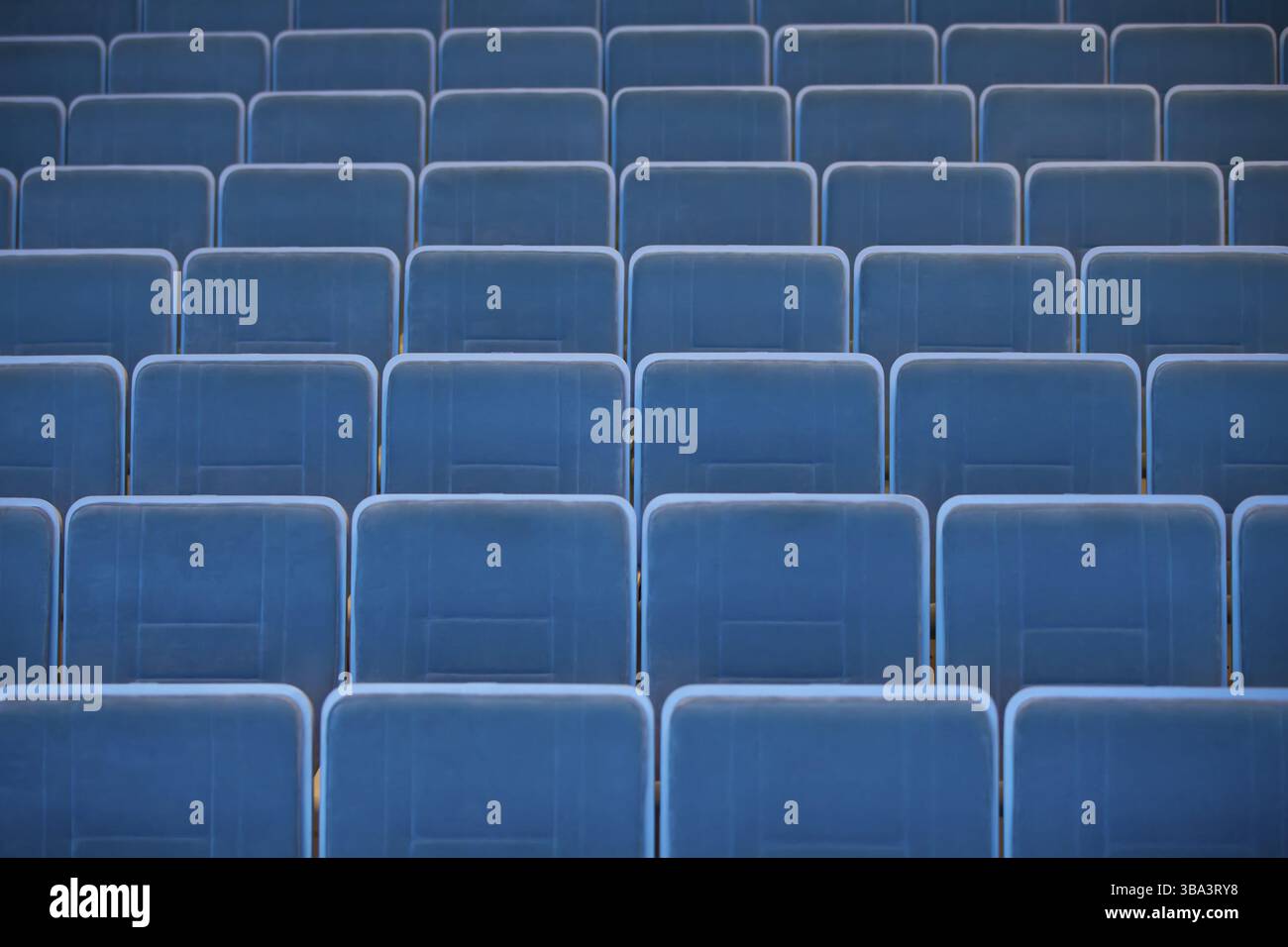 A row of empty chairs in the auditorium of the cinema Stock Photo - Alamy