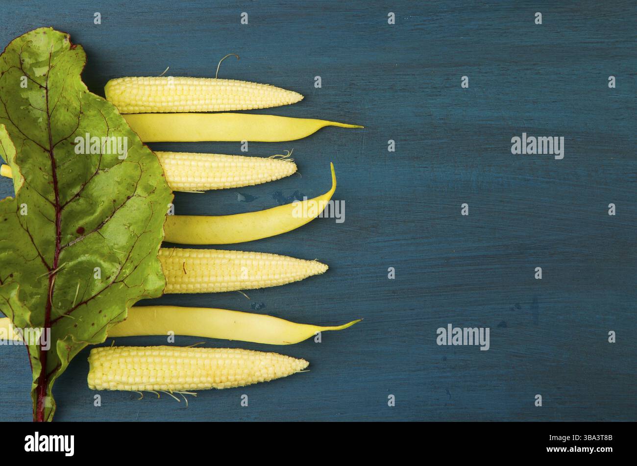 BEET LEAF FRESH RAW CORN UNDER THE BRIGHT WOODEN SURFACE Stock Photo ...