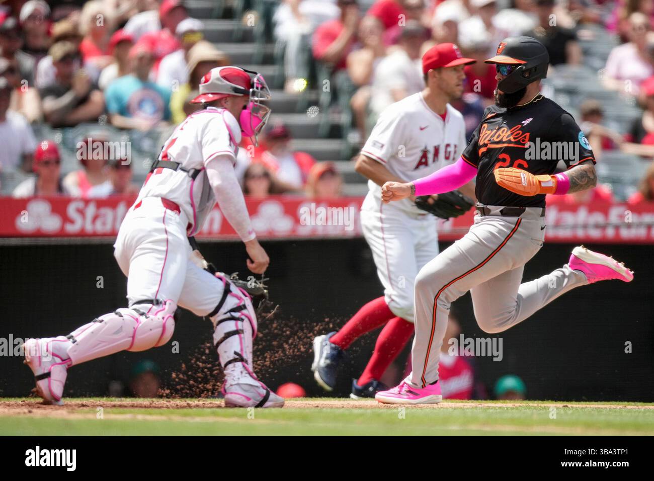 Baltimore Orioles' Emmanuel Rivera, right, tries to beat the throw to ...