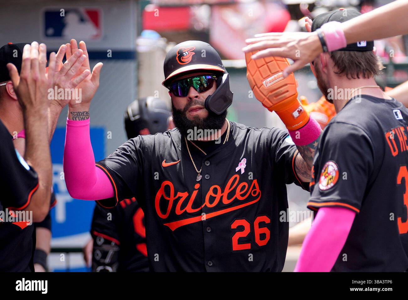 Baltimore Orioles' Emmanuel Rivera (26) high-fives teammates in the ...