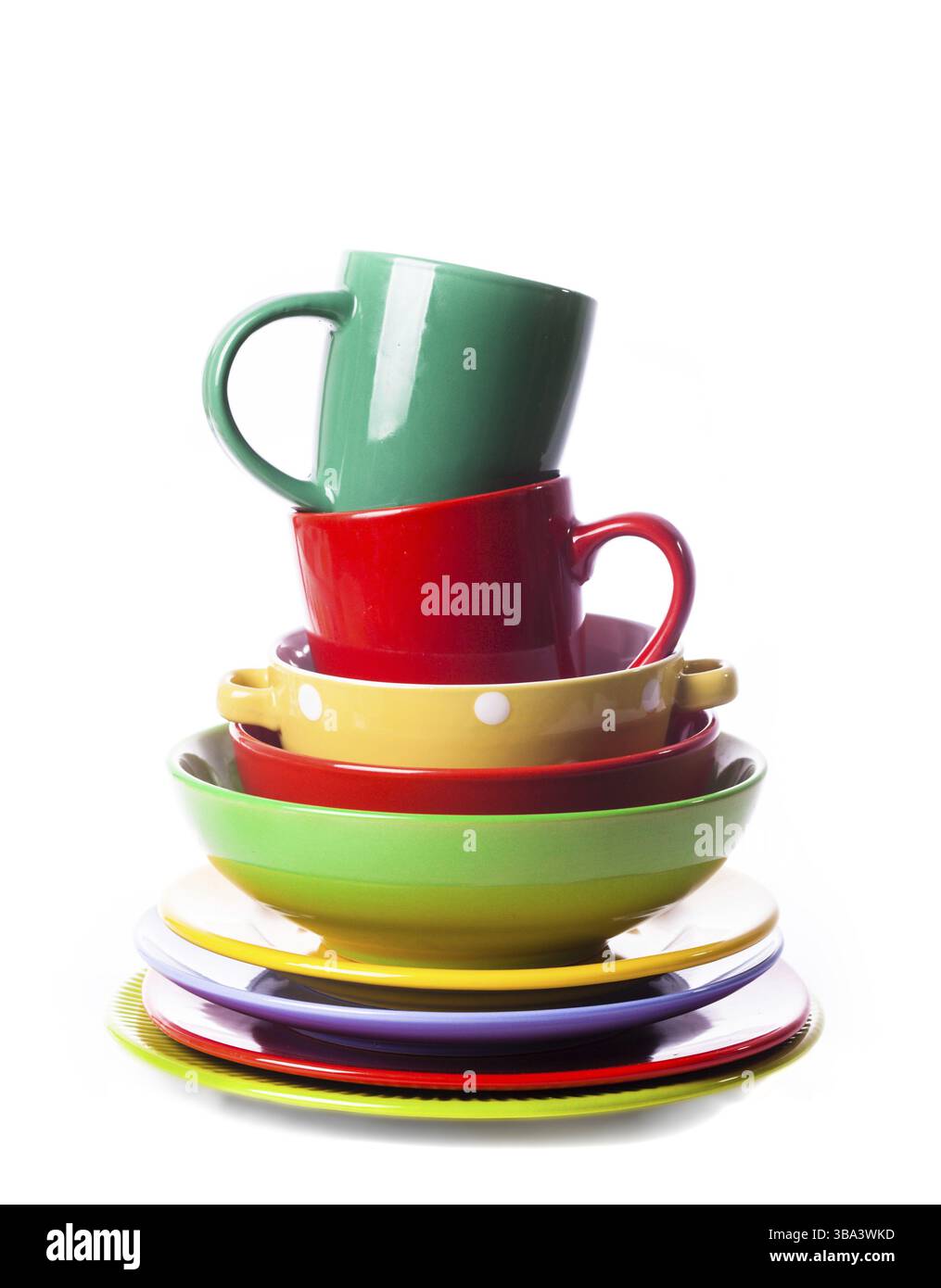 Big stack of different colors mugs and plate on white background, one ...