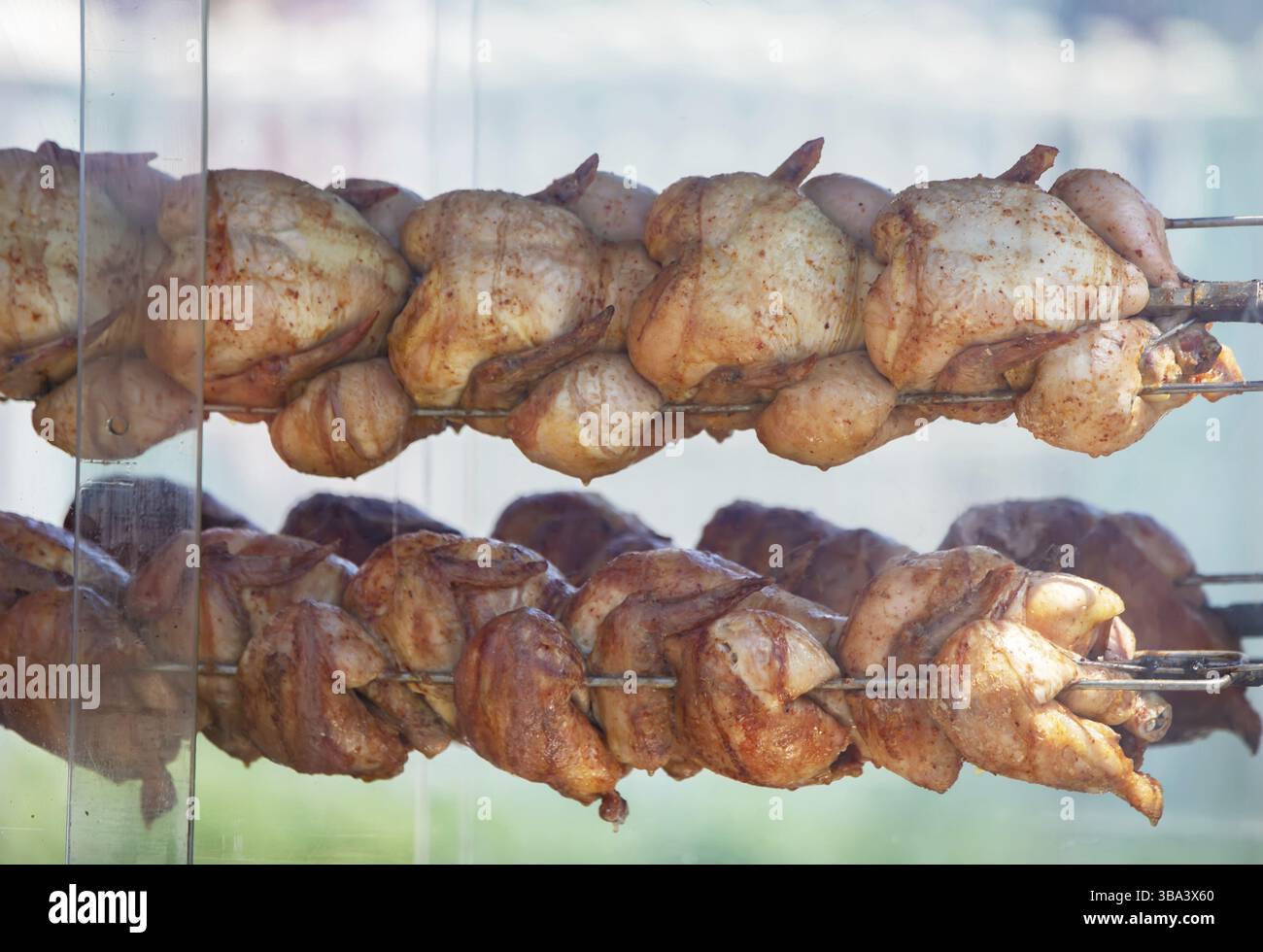 Chickens on the spit hi-res stock photography and images - Alamy