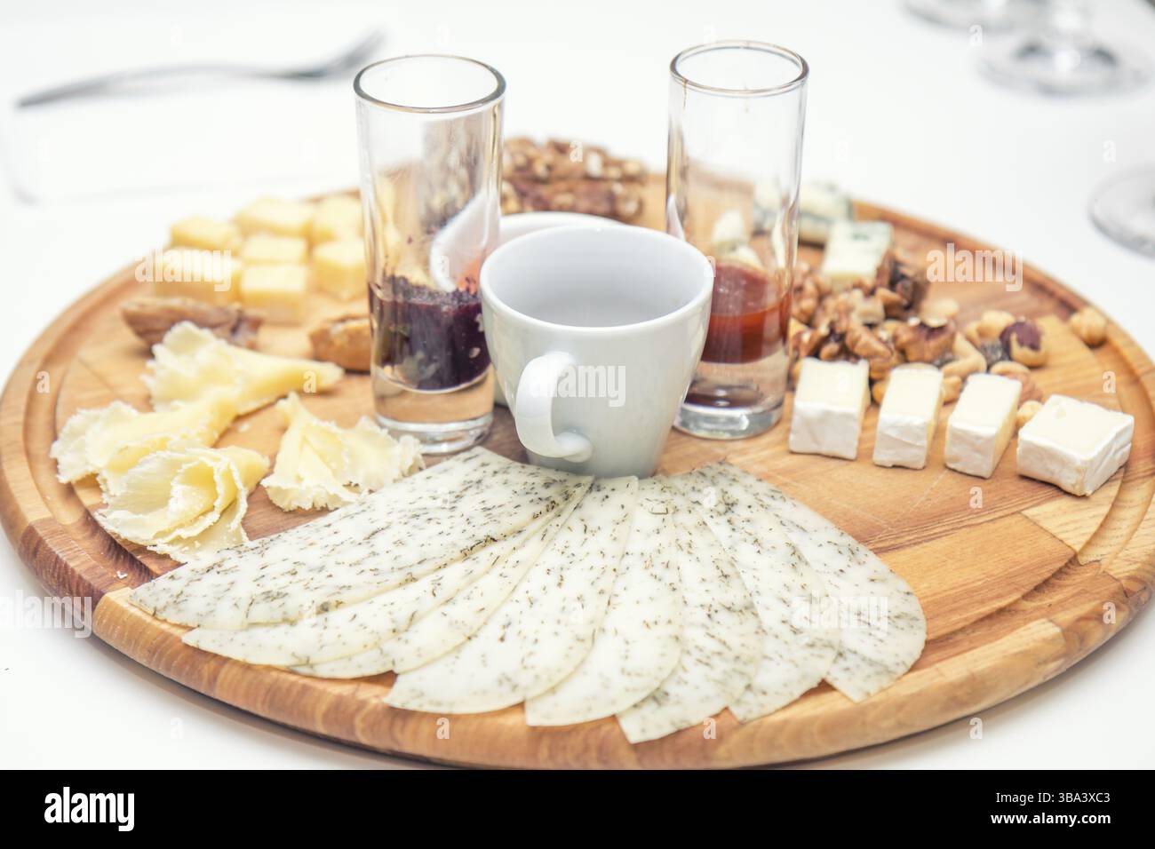 Different delicious cheeses brie, blue cheese, rosette of swiss cheese ...