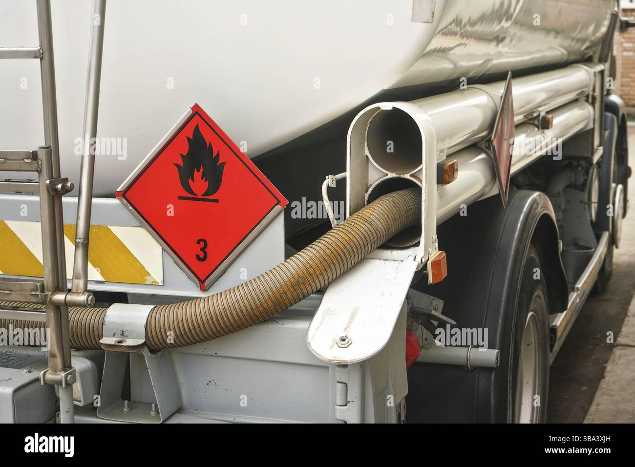 Red Warning hazmat Flammable class 3 liquid sign on back of fuel truck ...
