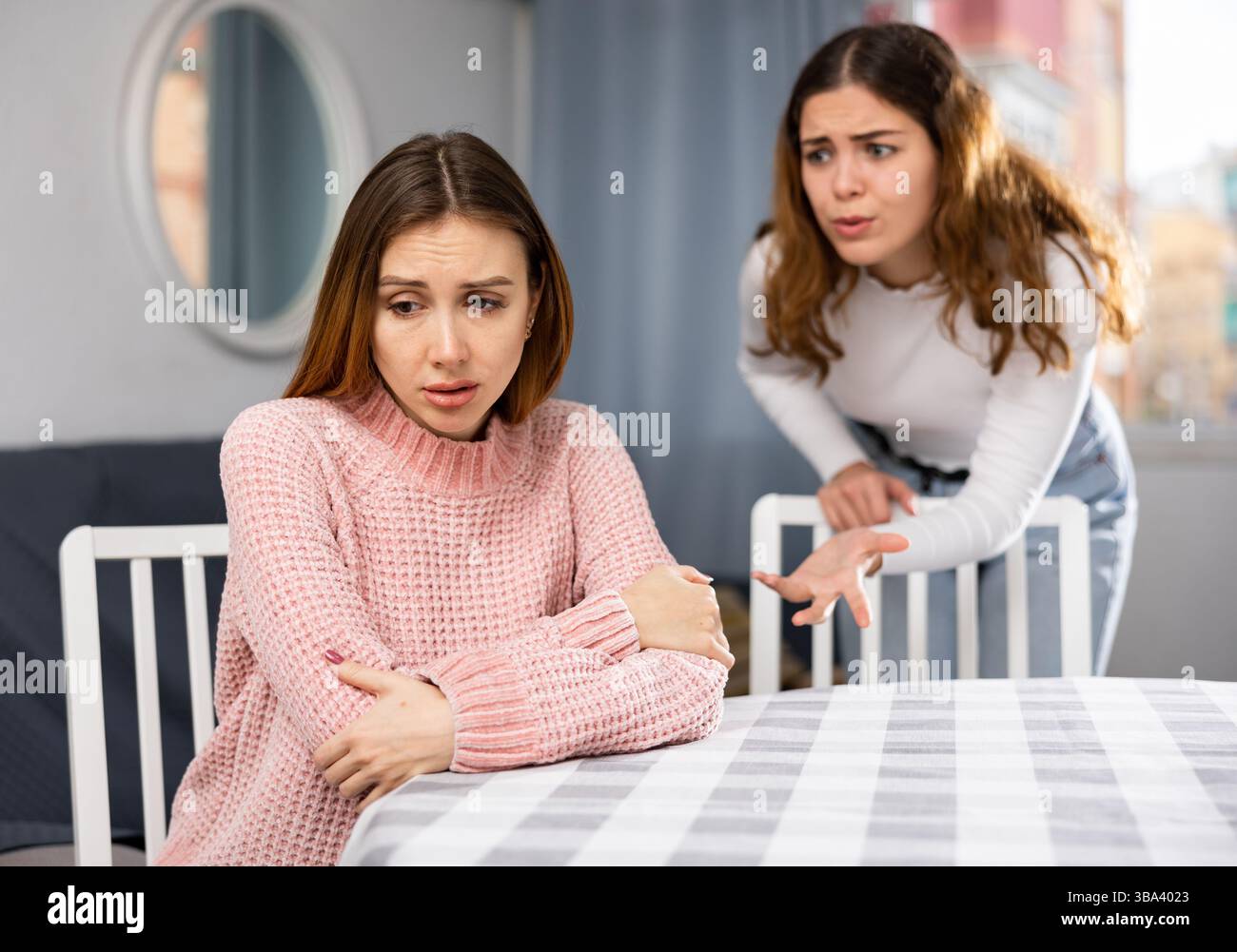 Girlfriend or sister yelling at girl during family quarrel Stock Photo ...