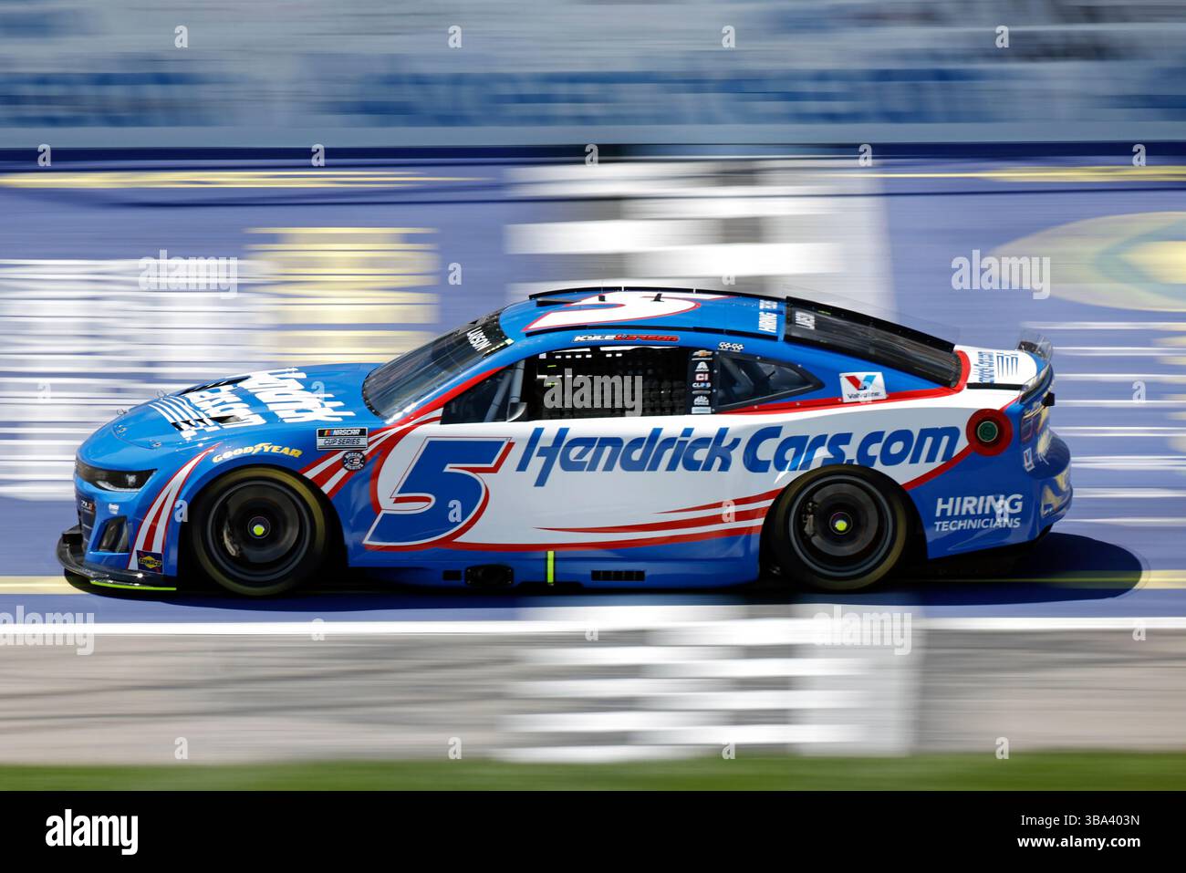 Kyle Larson crosses the start/finish line during the first stage of a ...