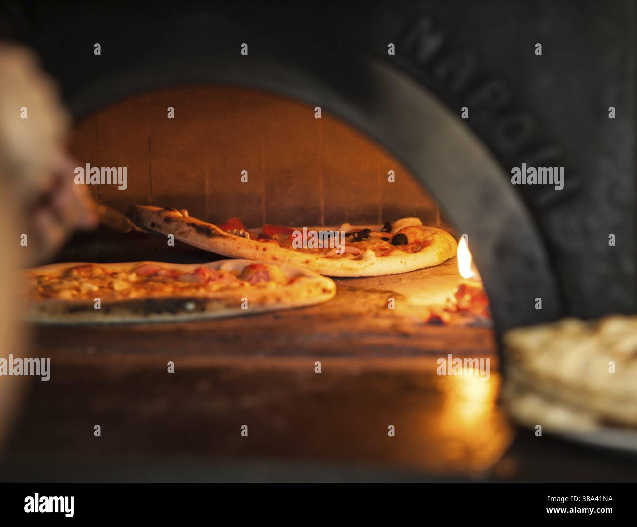 Pizza baking close up in the oven Stock Photo - Alamy