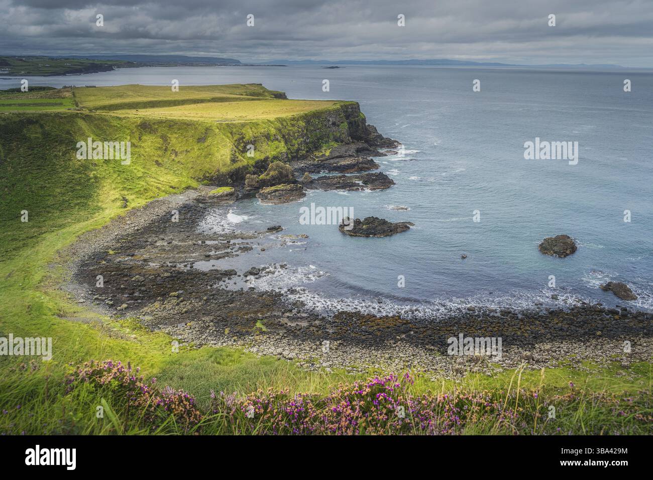 Giants Causeway bay with turquoise water, seen from top of the cliff ...