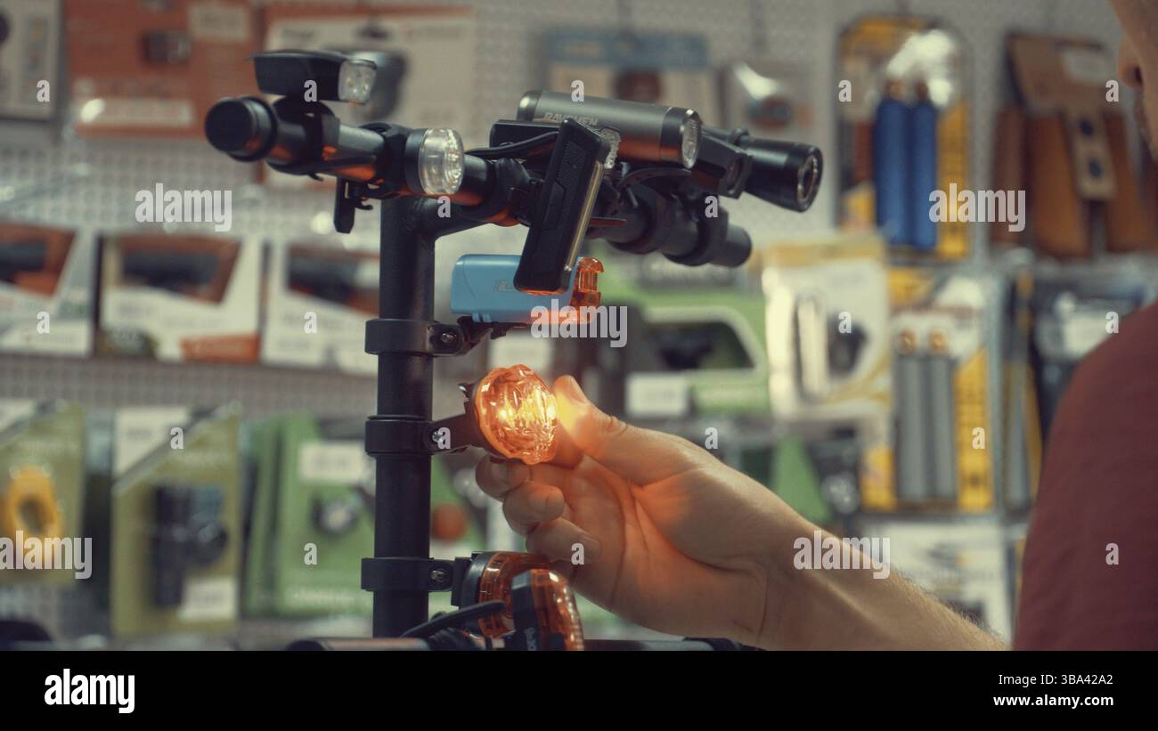 A young Caucasian man stands near the shelter and chooses, presses the ...