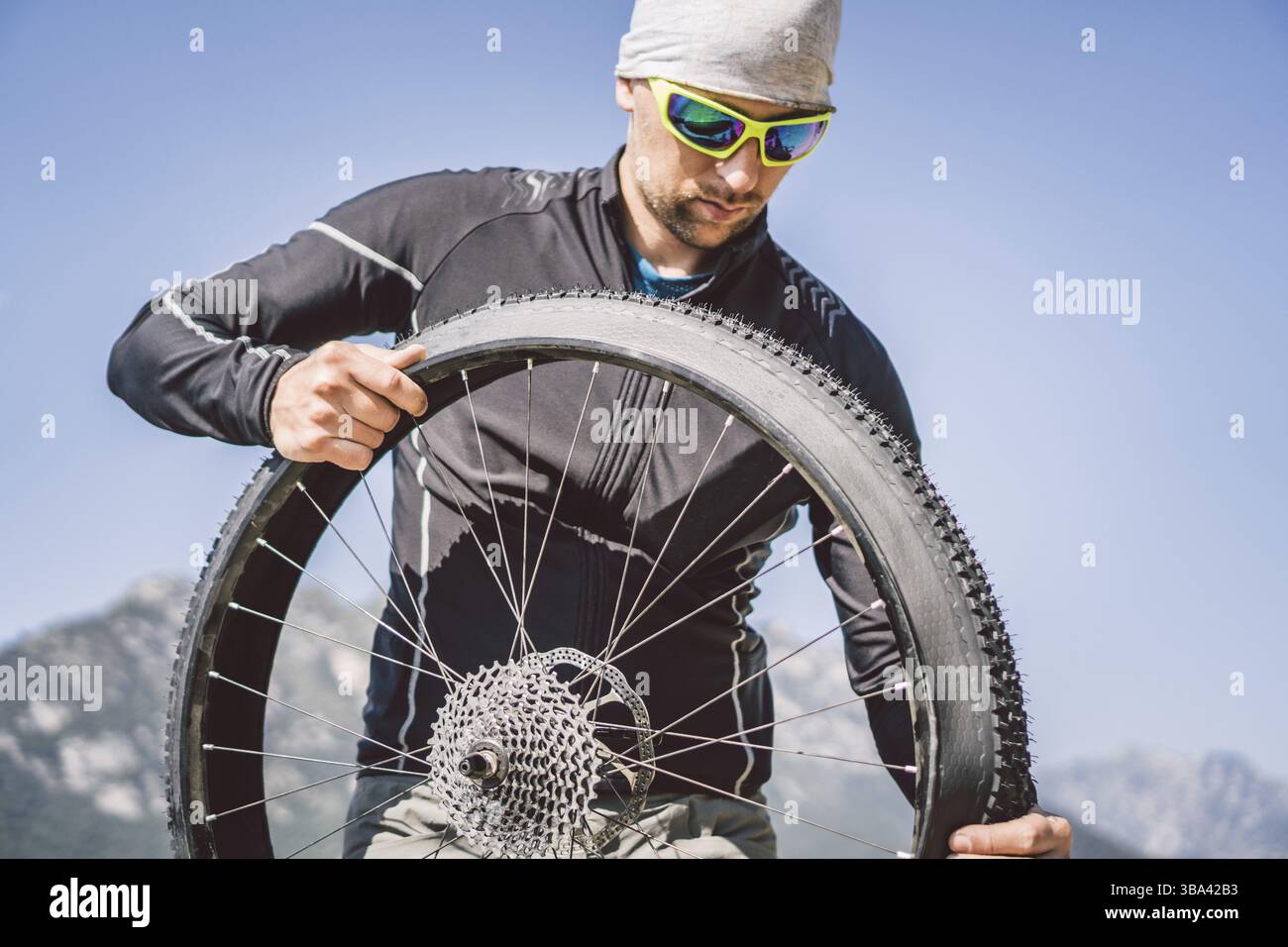 Bike Repair. Man Repairing Mountain Bike. Cyclist man in trouble rear ...