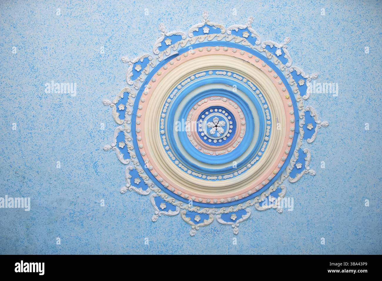 Round beautiful stucco pattern on the ceiling. Relief plaster, relief ...