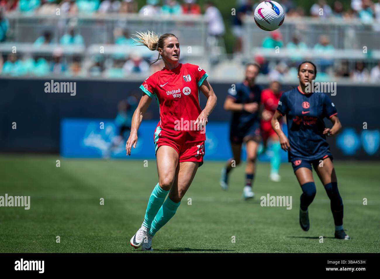 KANSAS CITY, MO - MAY 11: KC Current forward Haley Hopkins (13) tracks ...