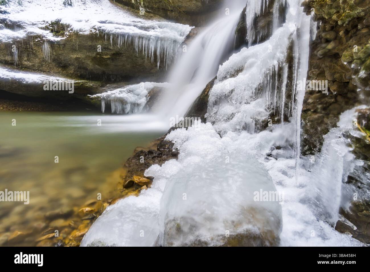 The beautifully icy Scheidegger waterfalls with a hike in the area Stock Photo - Alamy