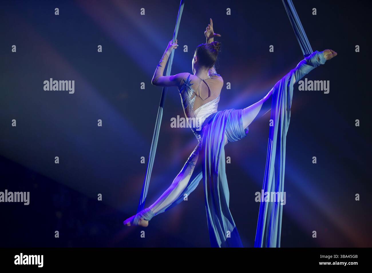 Performance by a circus acrobat artist. Girls perform aerial acrobatic ...