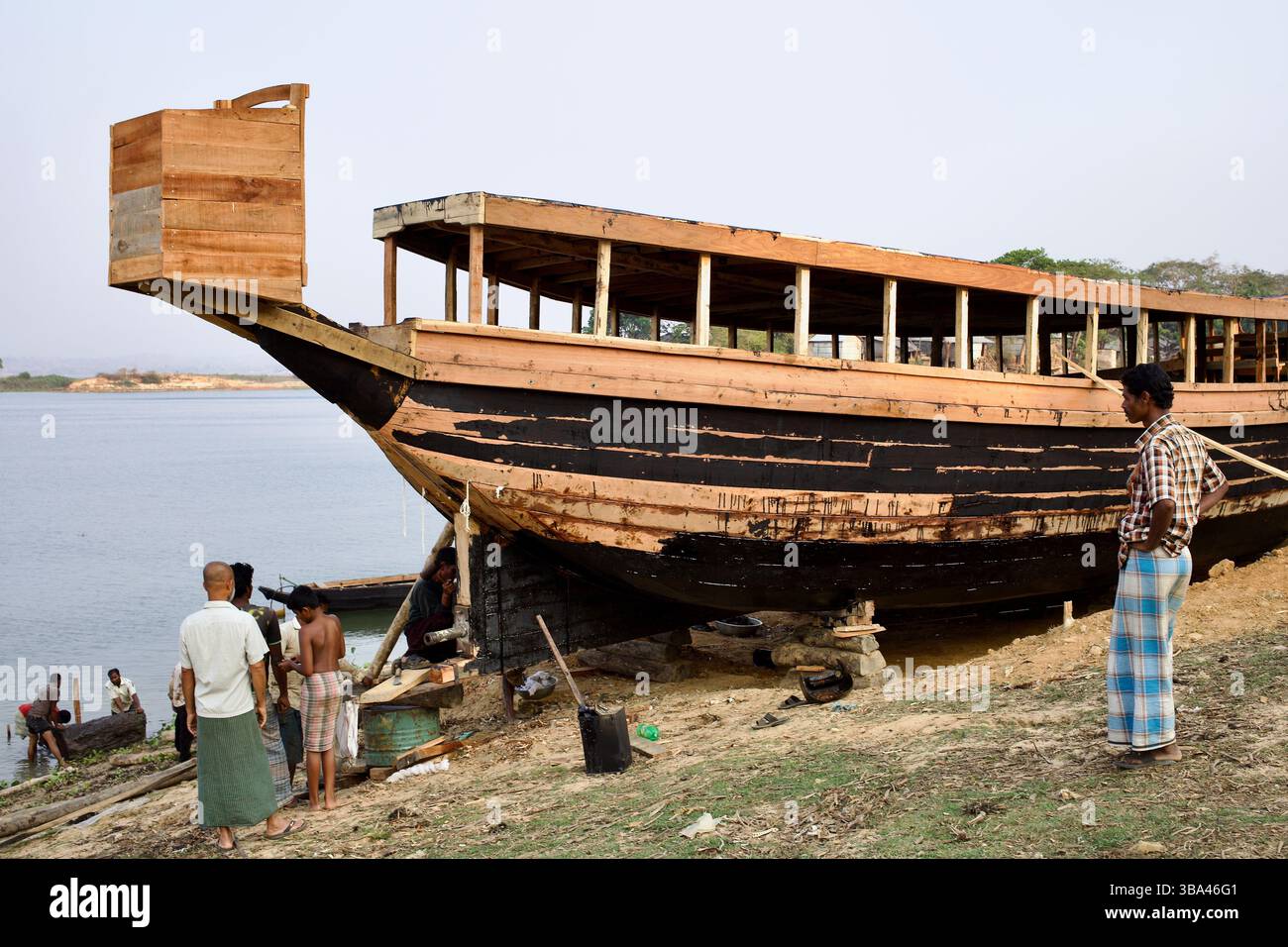 Large wooden passenger boat under construction by the shores of Kaptai Lake near Rangamati ...
