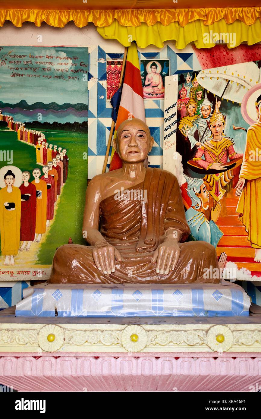 Life-size statue of a revered monk and narrative mural panels adorn the ...