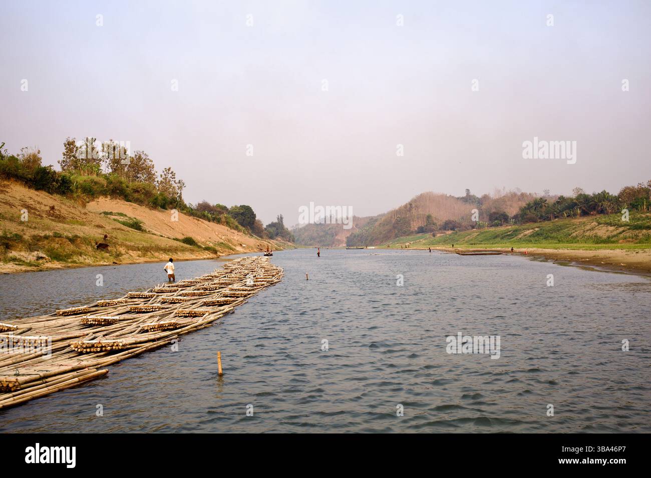 A bamboo raft floats down the Sangu River near Bandarban, Bangladesh ...