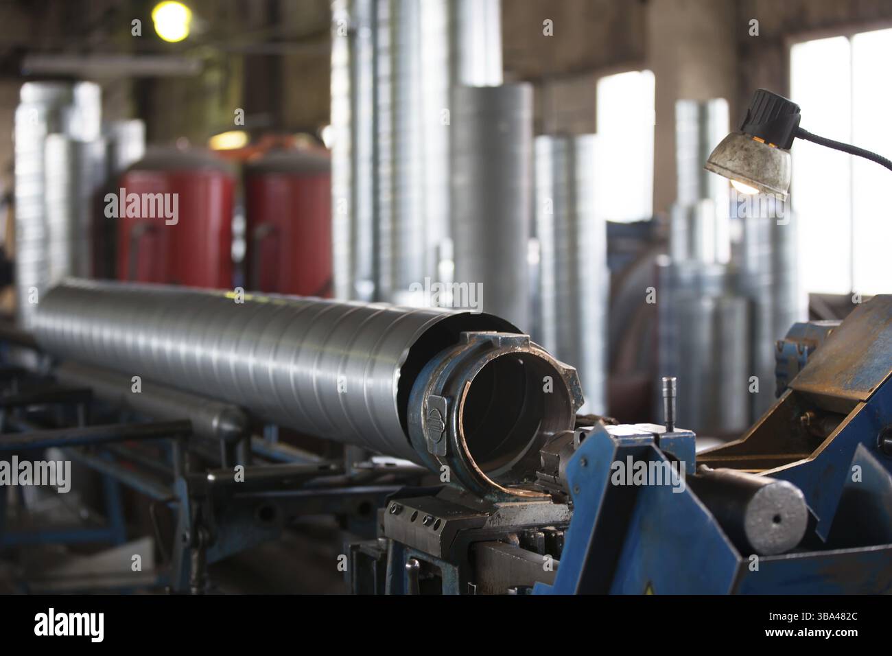 Manufacture of metal vent pipes in the factory Stock Photo - Alamy