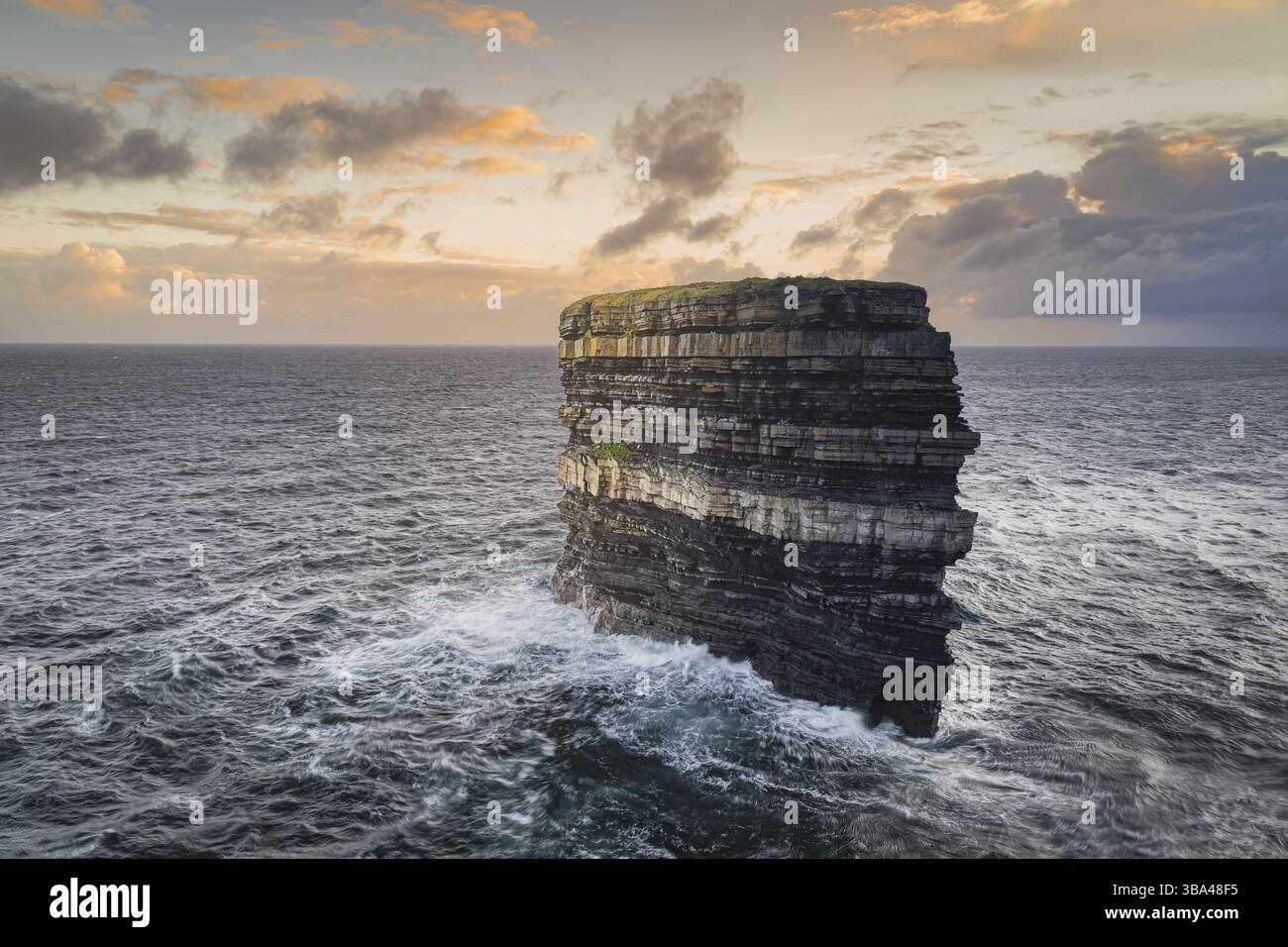 Large sea stack Downpatrick Head, with rock layers of millennia of ...