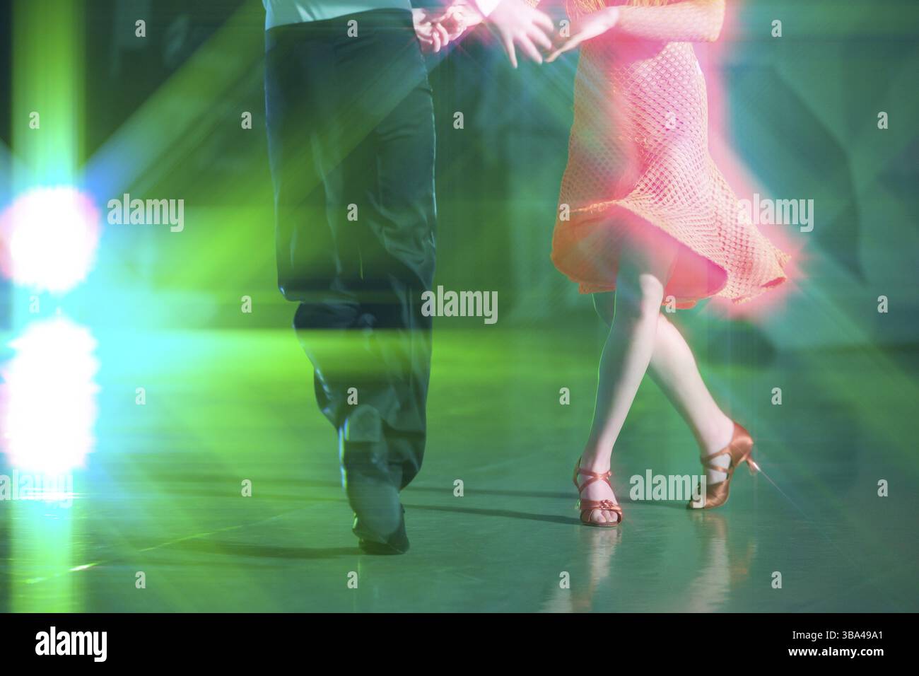 Abstract background of ballroom dancing in the rays of stage lighting ...
