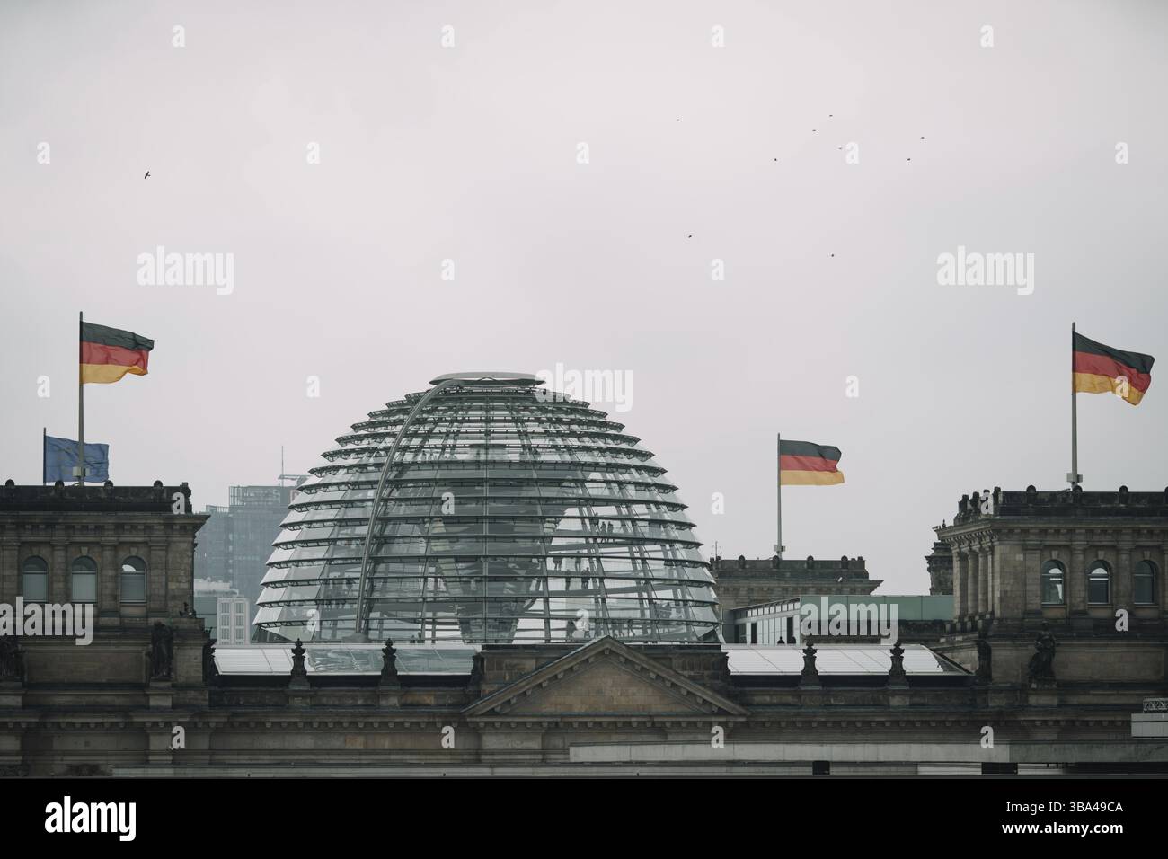 Building of the German Bundestag in Berlin from outside with flags ...