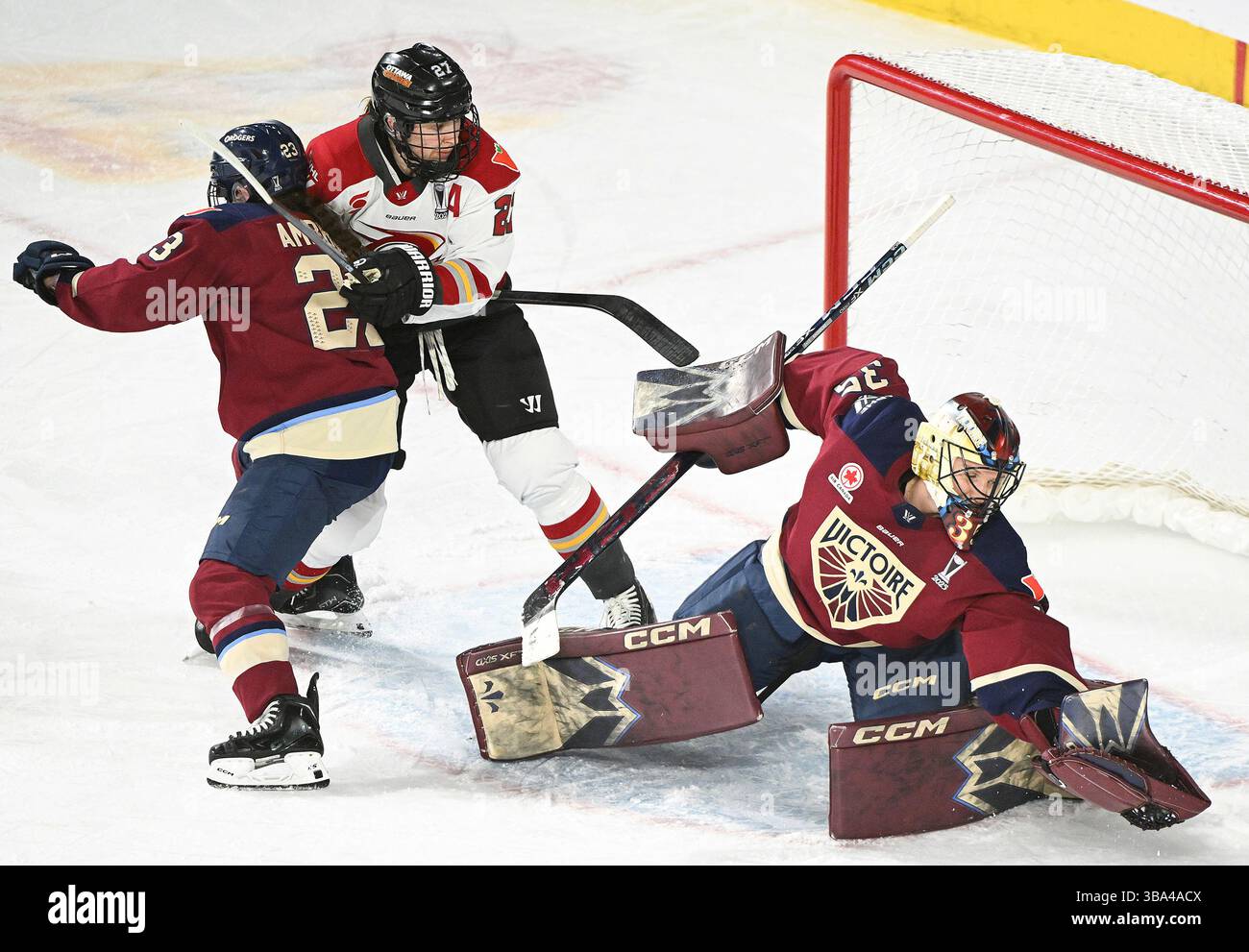 Montreal Victoire goaltender Ann-Renee Desbiens, right, makes a glove ...