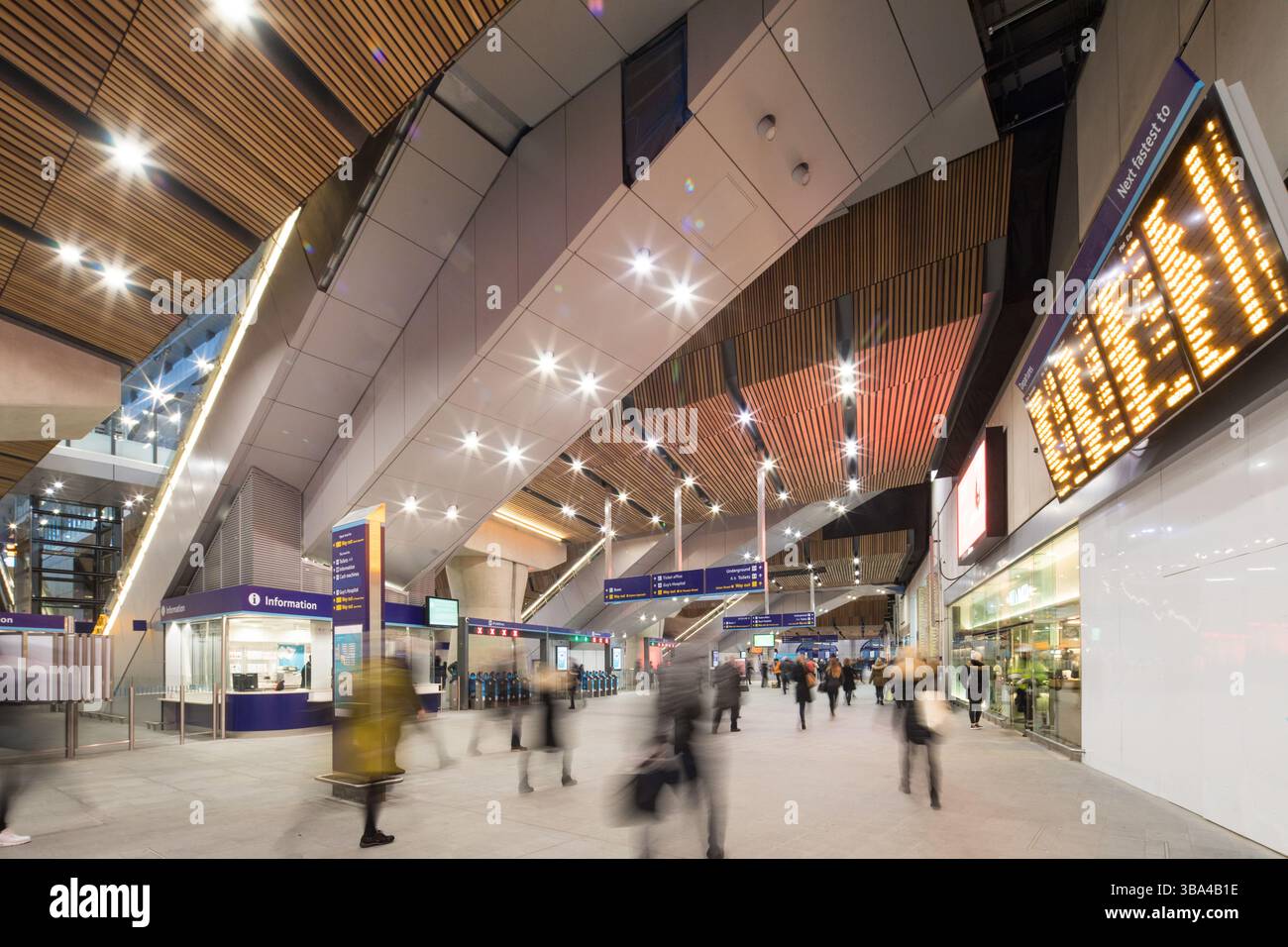 Commuters pass through the modern concourse of London Bridge Station ...