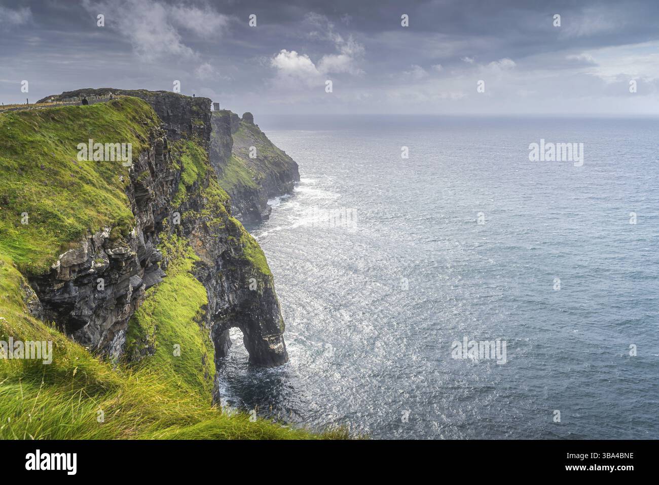 Natural rock arch, part of iconic Cliffs of Moher, popular tourist ...