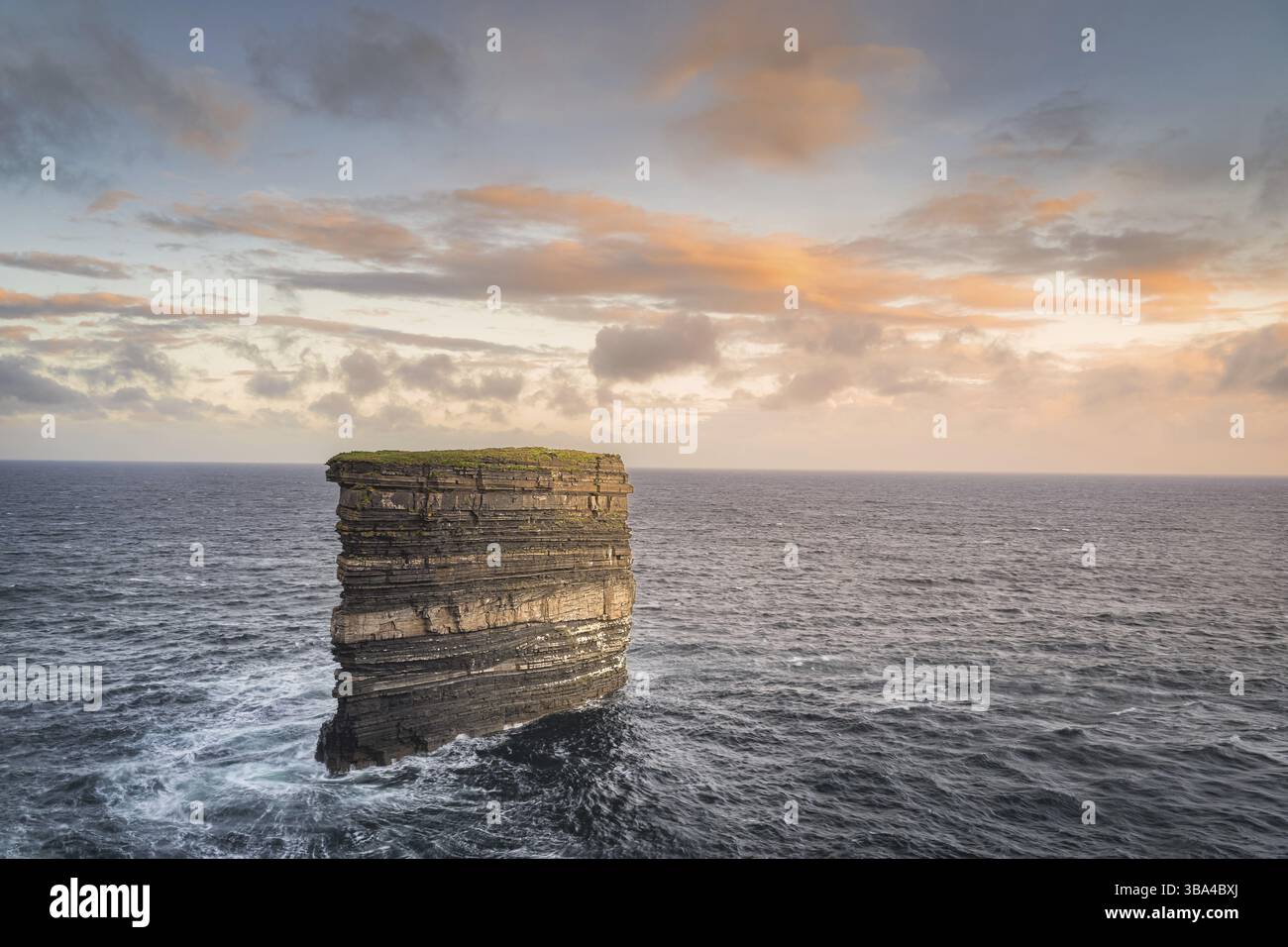 Beautiful sea stack Downpatrick Head, with rock layers of millennia of ...