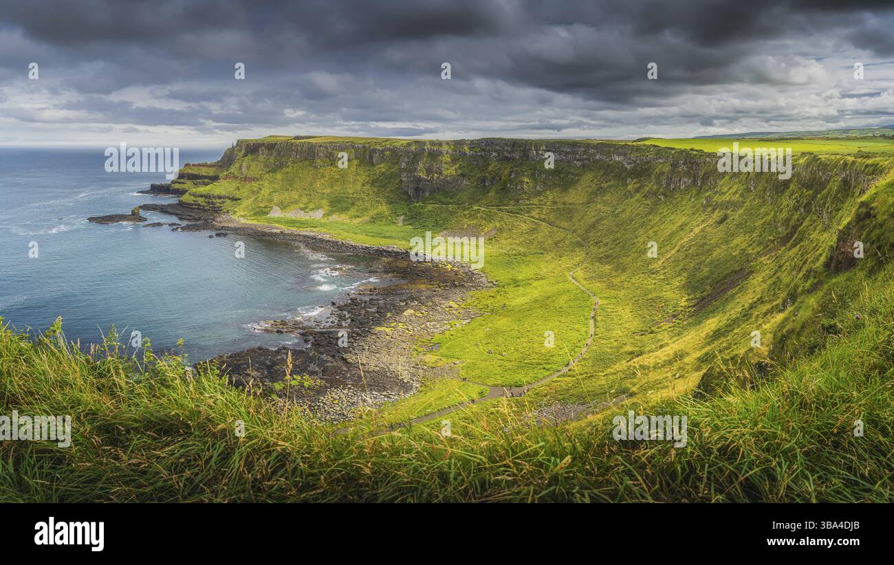 Panorama of Giants Causeway with dramatic light and sky, seen from top ...