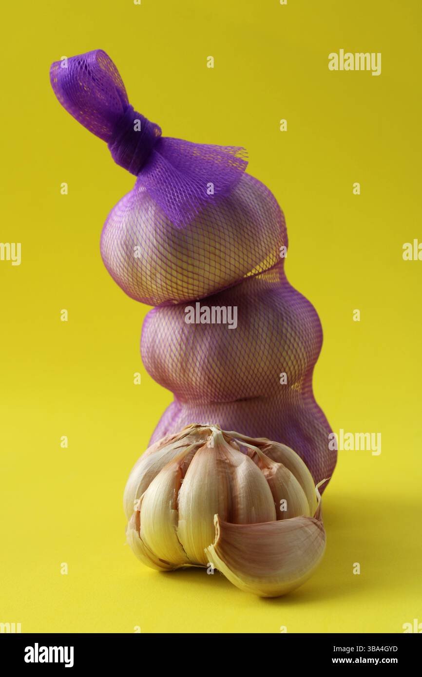 Garlic heads inside and outside a mesh, a nutritious condiment for ...