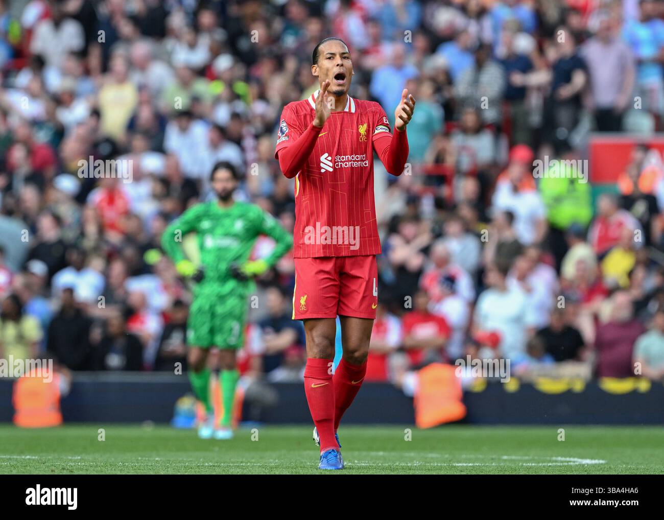 Liverpool, UK. 11th May, 2025. Virgil van Dijk of Liverpool encourages ...