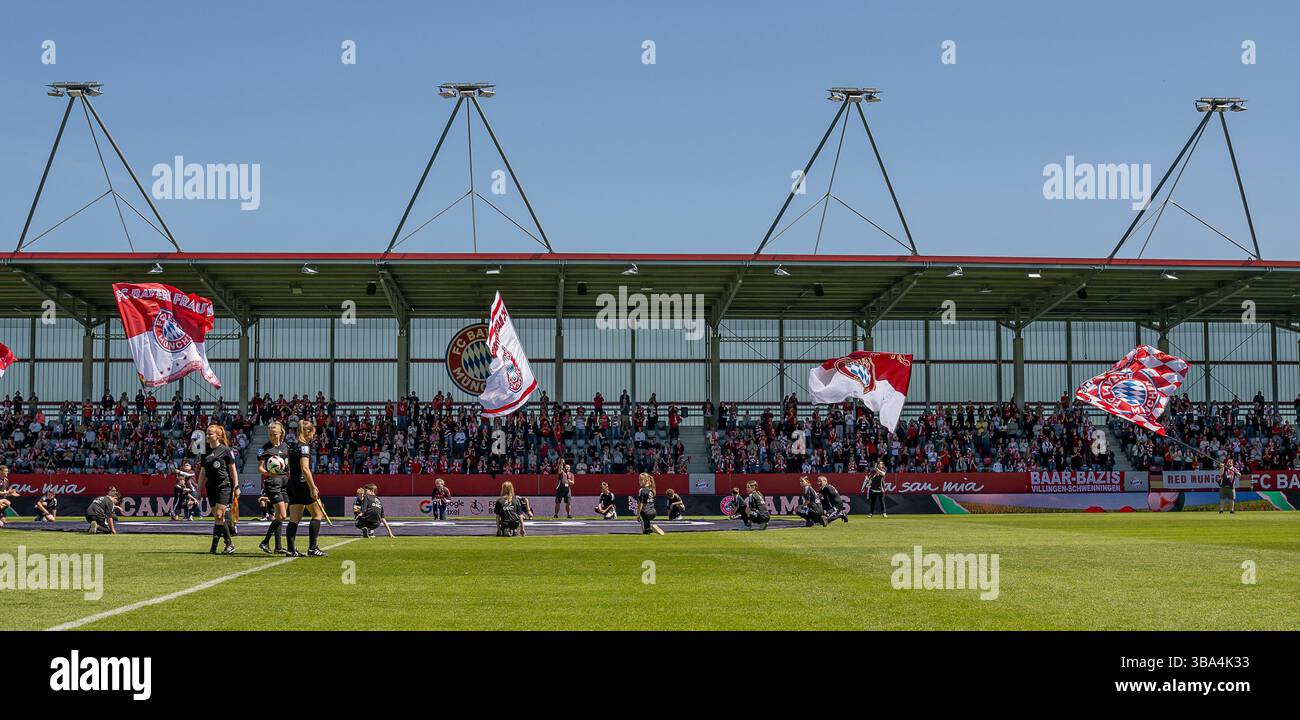 Muenchen, Deutschland. 11th May, 2025. Fahnenschwenker vor der Tribuene ...
