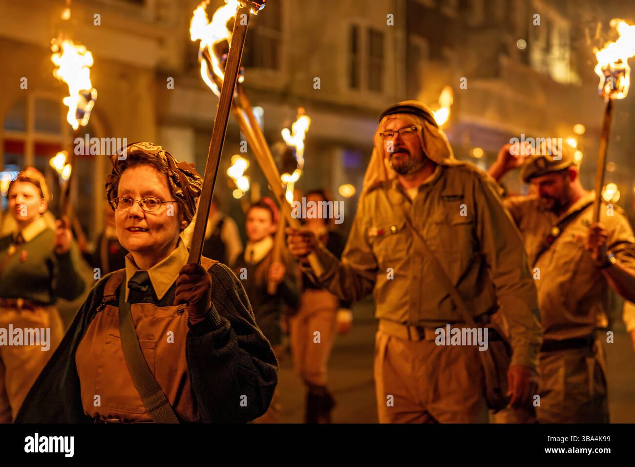 Lewes Bonfire Societies unite in a historic joint torchlit procession to mark VE Day, marching ...