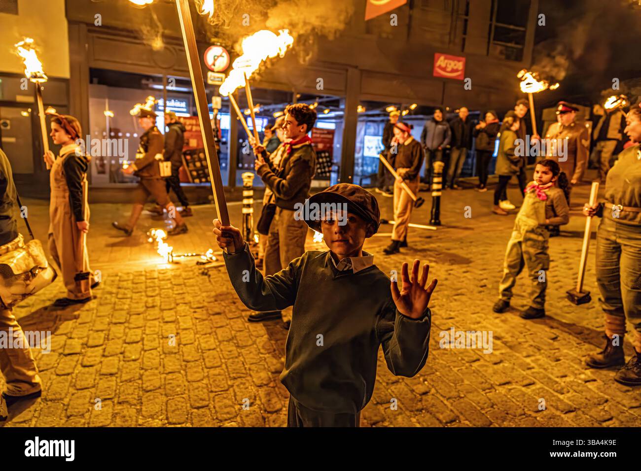 Lewes Bonfire Societies unite in a historic joint torchlit procession to mark VE Day, marching ...