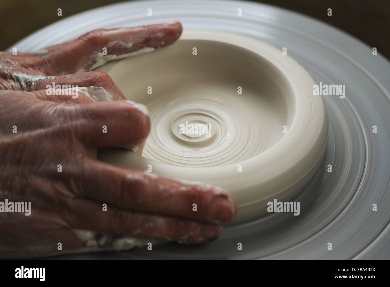 Potter works. Crockery creation process in pottery on potters' wheel ...