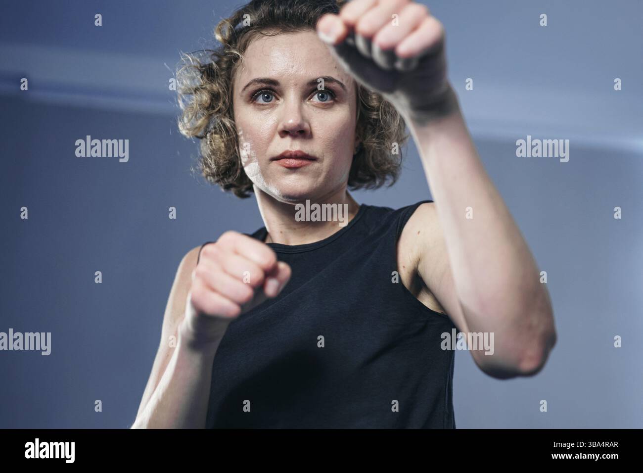 Female fighter throws punches hi-res stock photography and images - Alamy