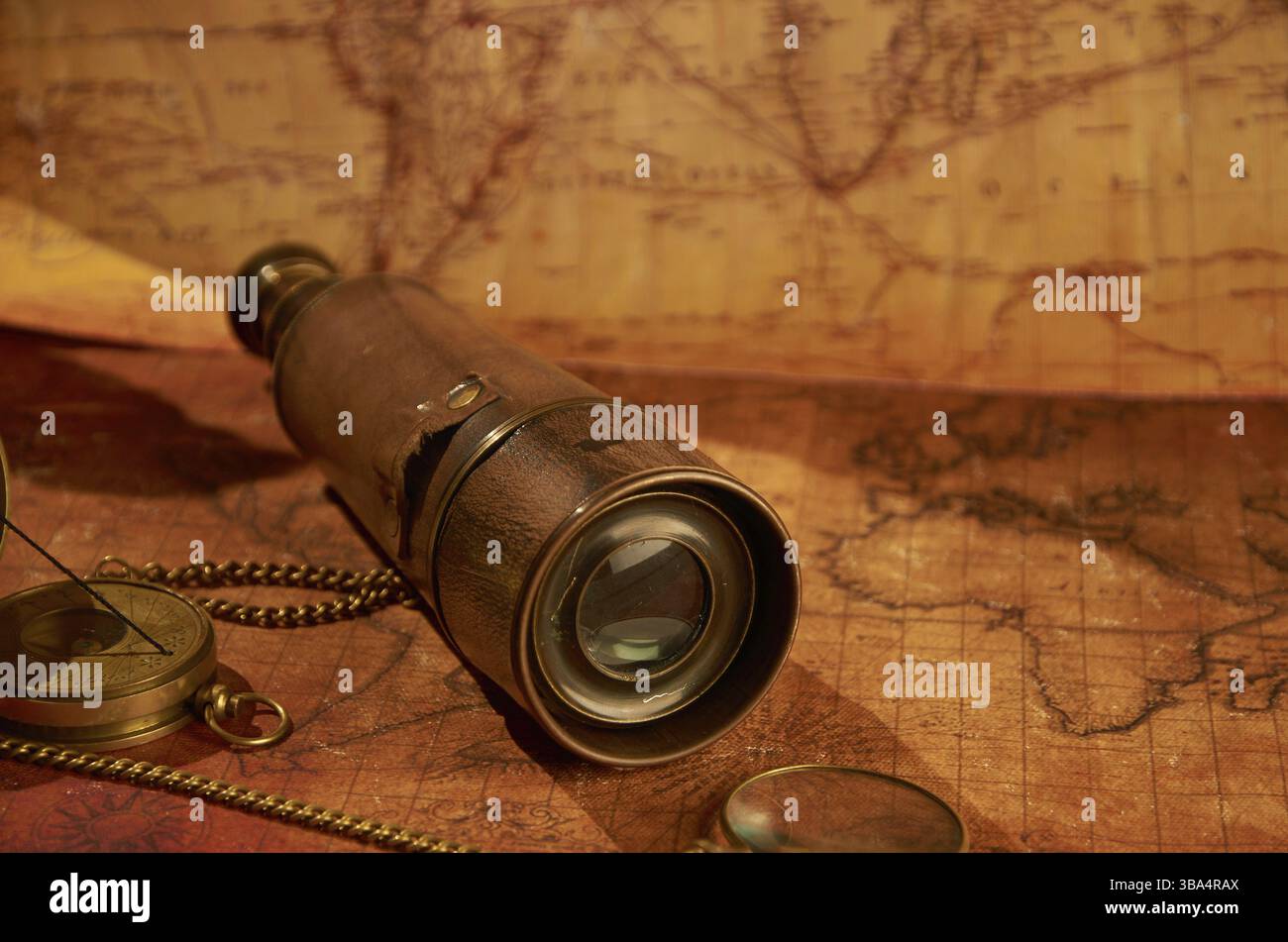 Retro telescope lying on the old map Stock Photo - Alamy