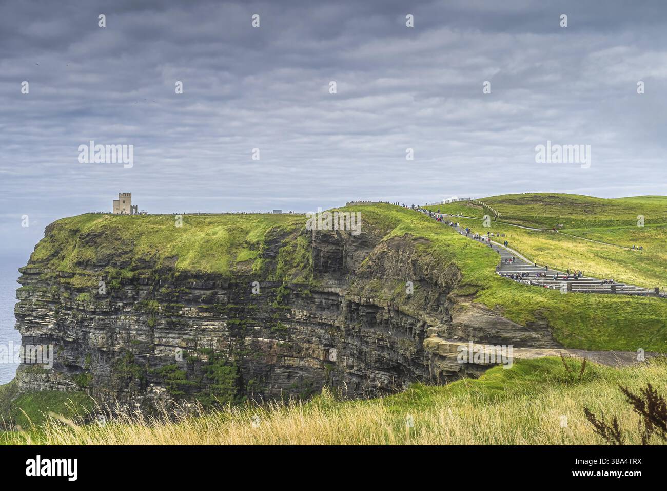 Crowds of tourists walking on stairs to OBriens Tower on iconic Cliffs ...