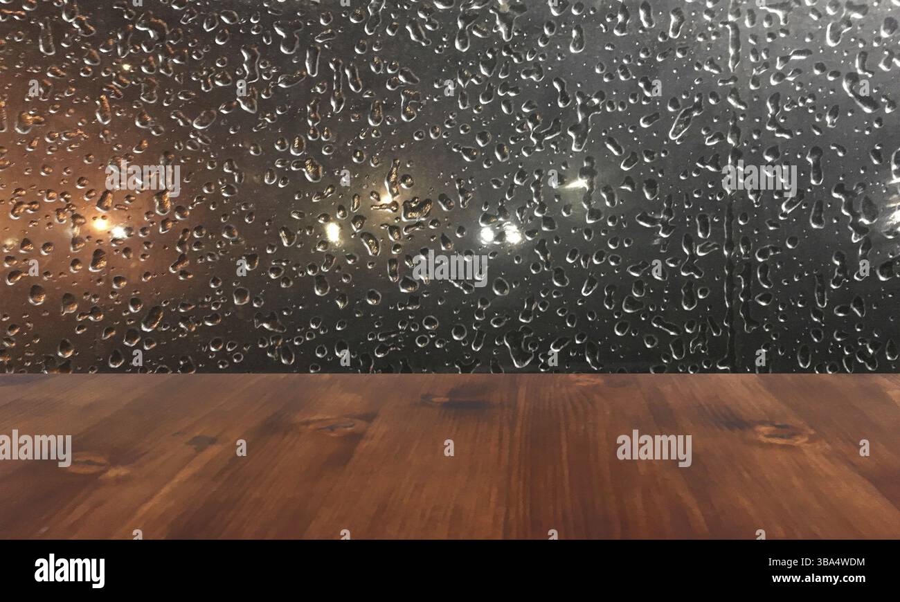 Old brown oak wood table on the blurry drop on window background ...
