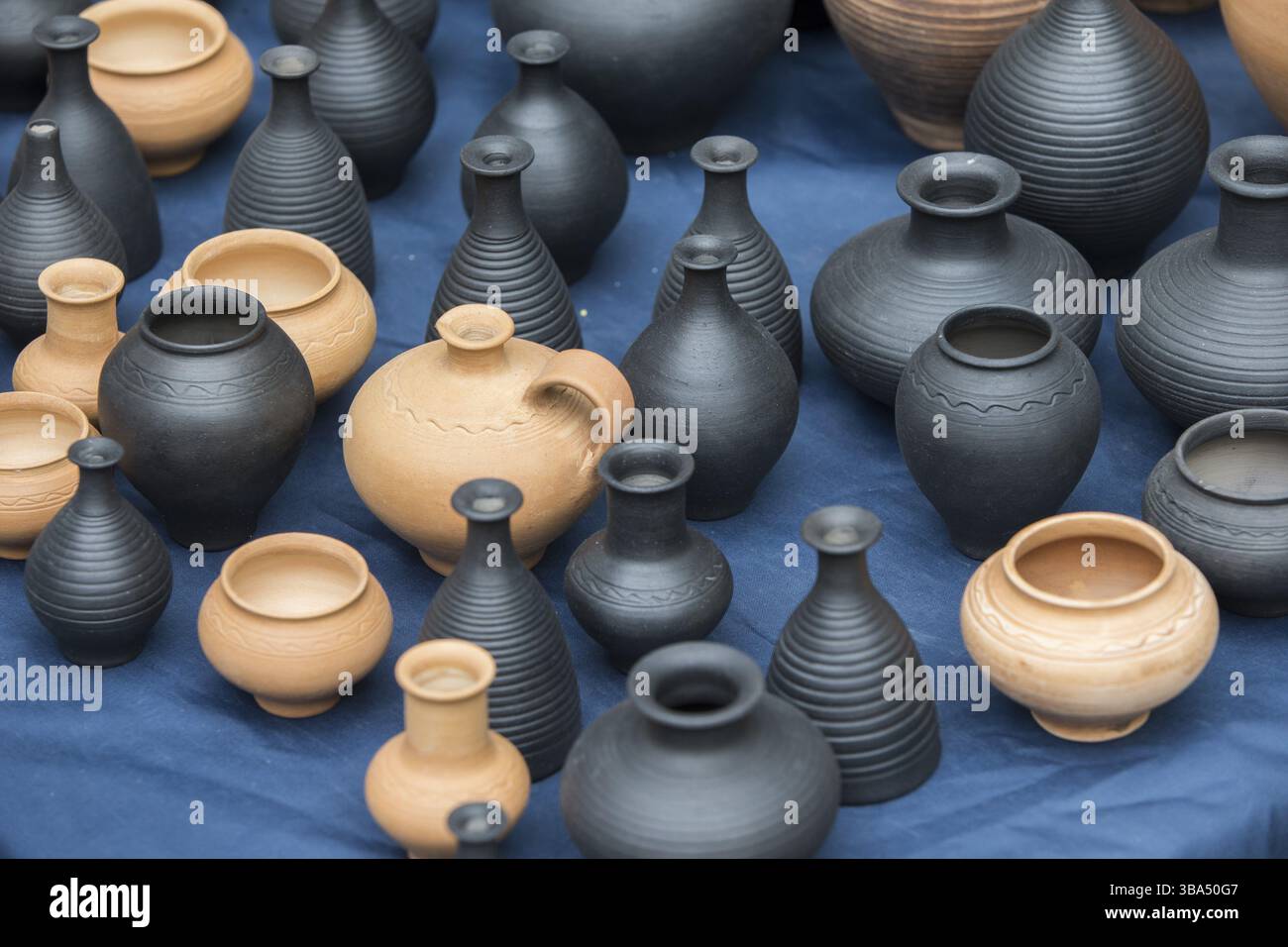 Clay vessels of different colors. Ceramics Stock Photo - Alamy