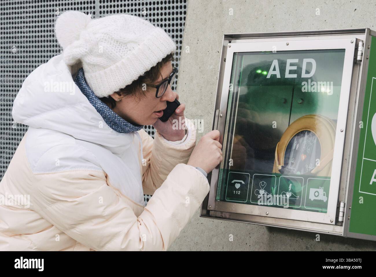 Medicine cardiopulmonary resuscitation emergency call. Caucasian woman uses telephone calling ...