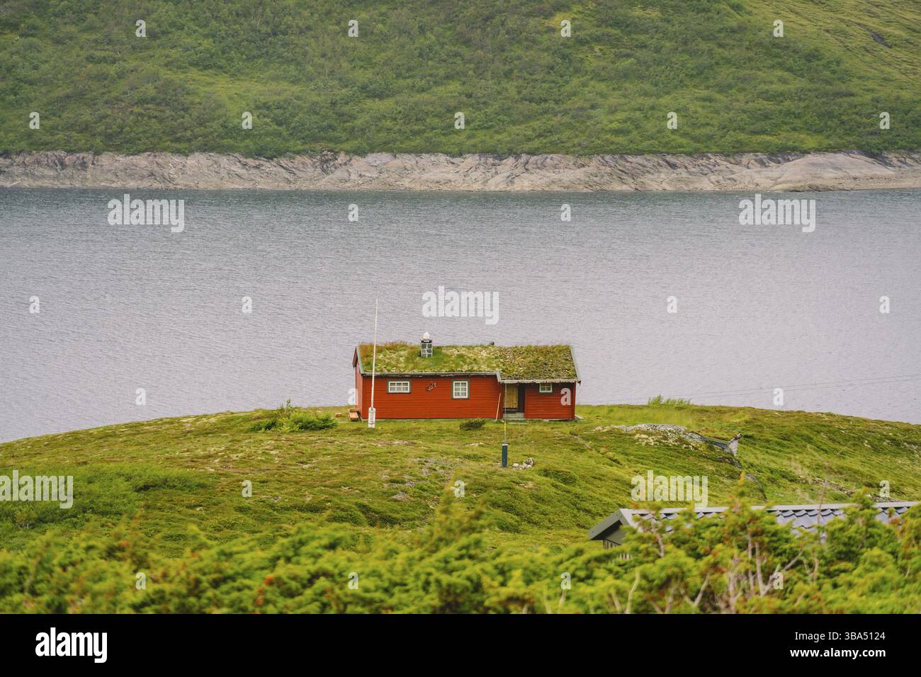 Norwegian wooden summer house (Hytte) overlooking scenic lake, Norway ...